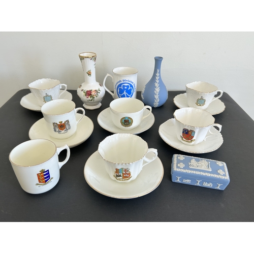 A selection of crested ware cups and saucers together with Wedgwood and ...