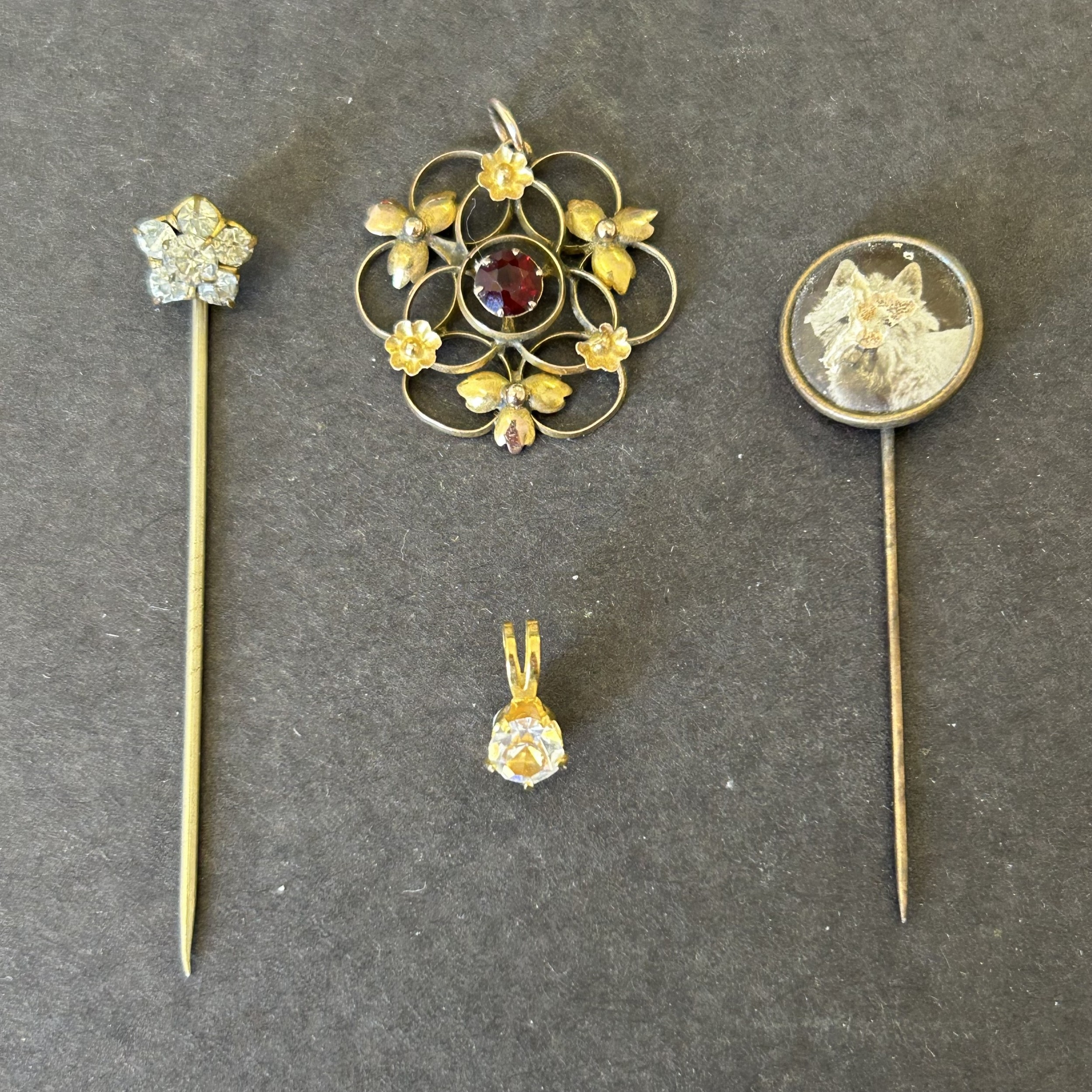 A vintage 9ct gold with red stone set pendant, weight approx. 1.8g plus ...