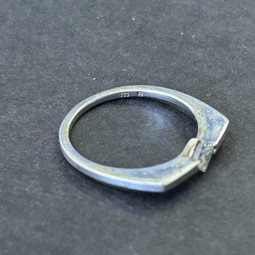 A 333 (approx. 8ct) marked ring with white stone (does not test as a ...