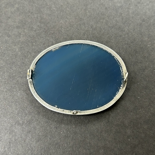 A white metal stone set bangle, a blue stone set brooch (as found pin ...