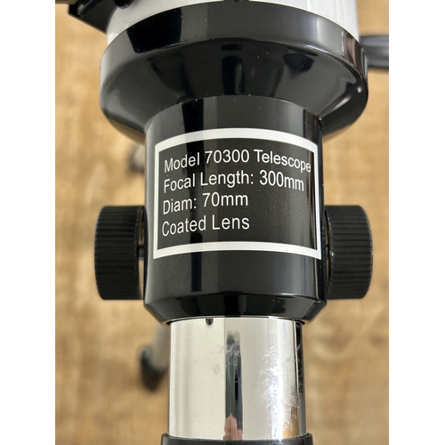 A Model 70300 Ground Astronomical telescope with stand and accessories