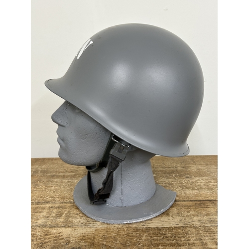 A vintage COPY of a U.S. Navy (USN) M1 helmet in grey, this comes with ...