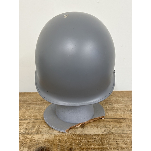 A vintage COPY of a U.S. Navy (USN) M1 helmet in grey, this comes with ...