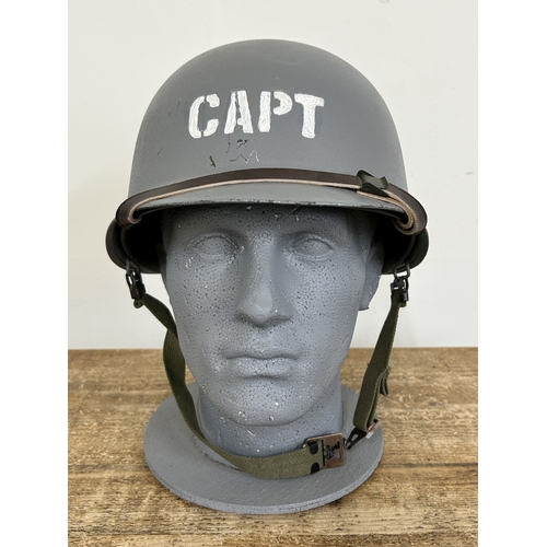 A vintage COPY of a U.S. M1 military helmet, Vietnam era Capt (Captain ...