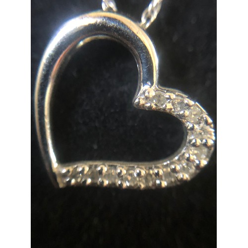 White gold .375 necklace and white gold .375 diamond heart pendant