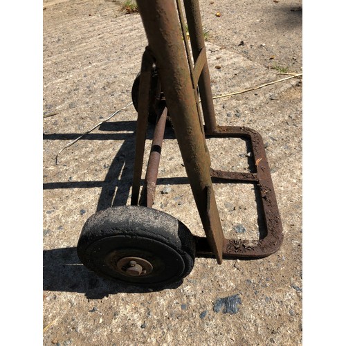 Porter trolley with hard wheels. Solid in good condition