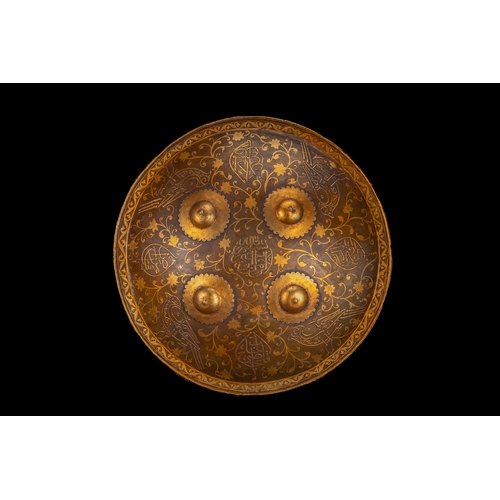 An Indian Gilded Iron Shield with Calligraphic and Floral Decoration. A ...