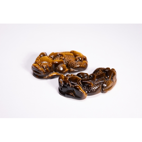 A Pair of Chinese Tiger's Eye Pixiu Beasts Pendant. This pair of ...