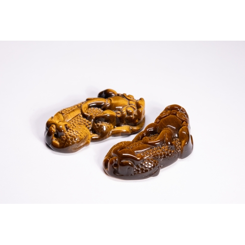 A Pair of Chinese Tiger's Eye Pixiu Beasts Pendant. This pair of ...