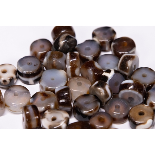 A Lot of Loose Dzi Agate Beads. This assortment features a collection ...
