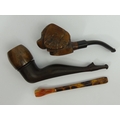 Bakelite stockinged leg pipe, dogs head pipe and a 1930's cigarette ...