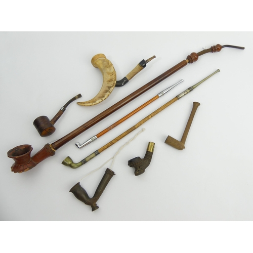 Eight various pipes including a Turkish Terracotta bowl with a long ...