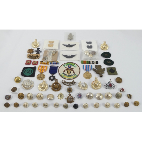 A quantity of military cap badges, including Northamptonshire Regt. two ...