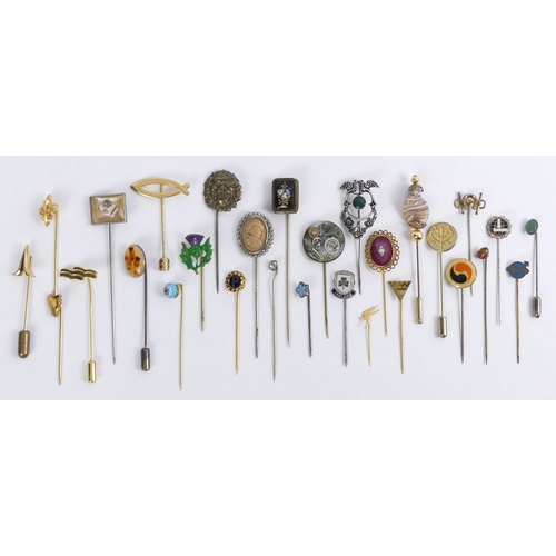 A collection of assorted stick pins, including a gold horseshoe and bit ...