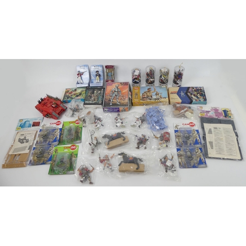 A box of plastic figures, including Airfix military figures, Cando ...