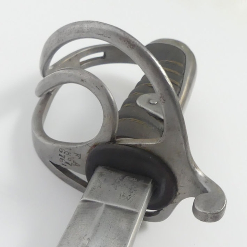 A heavy 19th century cavalry sword, dated 1897 in scabbard, blade 87cm.