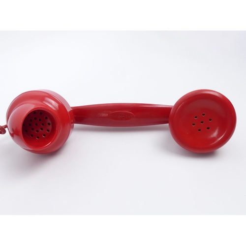 A vintage red bakelite telephone, the handset marked GPO PL35 234 No ...