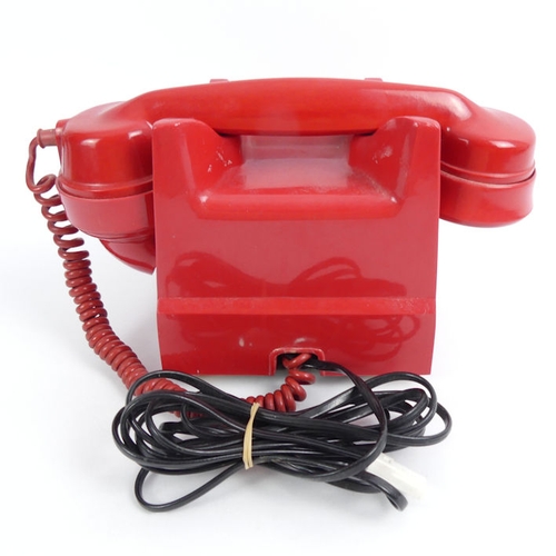 A vintage red bakelite telephone, the handset marked GPO PL35 234 No ...