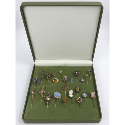 A collection of Victorian and later stick pins, including a carved ...