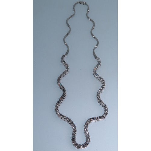 18ct white gold and diamond serpentine shaped necklace with eighty ...