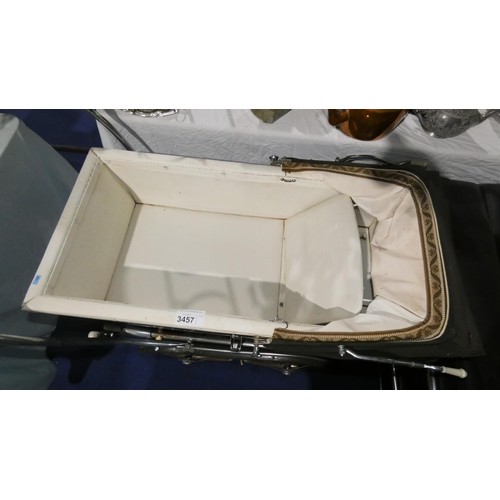 A vintage silver cross baby pram