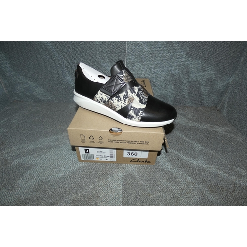 A pair of womens shoes by Clarks type Un Rio Strap Black combi leather ...