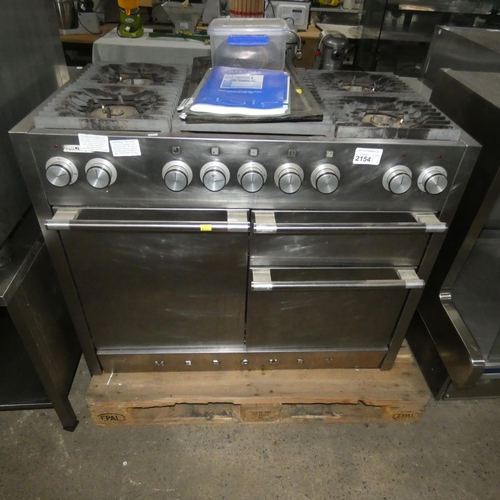 A commercial stainless steel dual fuel gas fired 5 burner range with 3 ...