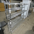 A commercial slimline catering type rack with 4 shelves approx 179x31x166