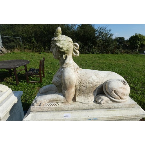 A very heavy white concrete statue of a Sphinx/half woman half lion ...