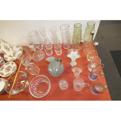 A quantity of miscellaneous tall glass jugs and vases and other ...