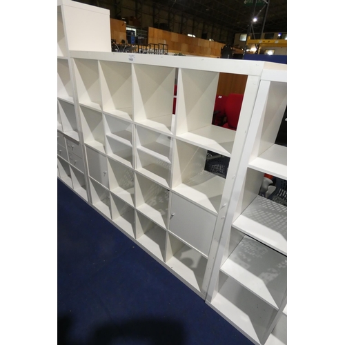 A white cube storage shelf unit with 16 cube sections, total approx ...