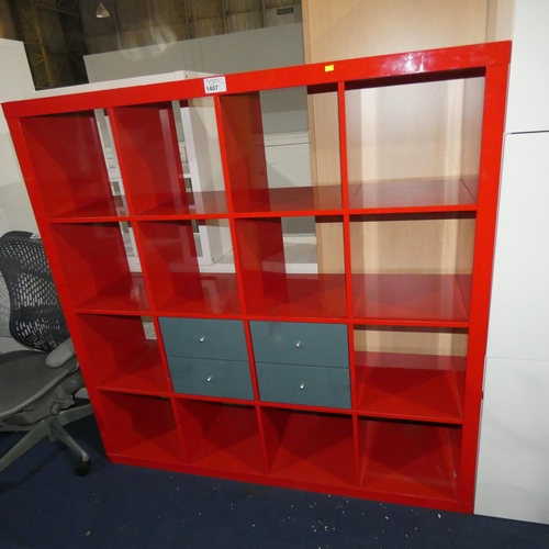 A red cube storage shelf unit with 16 cube sections, total approx ...