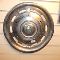 A vintage Rolls-Royce hubcap