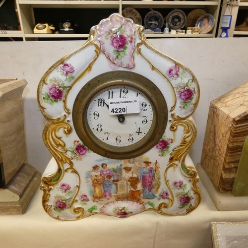 A very ornate floral and pictorial decorated china mantel clock