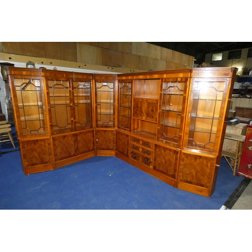 A range of reproduction yew wood floor standing units making a large ...