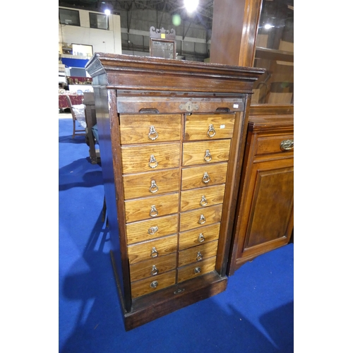 A vintage Oak tambour front cabinet enclosing 16 small drawers ...
