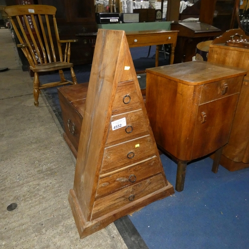A triangular hardwood chest of 5 graduated drawers