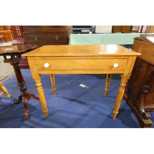 A Victorian stained deal rectangular top side table with one drawer ...