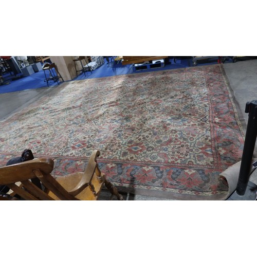 A large multi-coloured floral patterned carpet approximately 500cm X 415cm