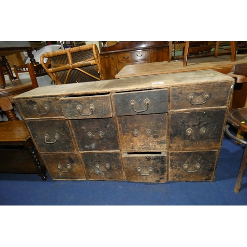 A vintage Pine multi-drawer chest of twelve drawers with drop handles ...
