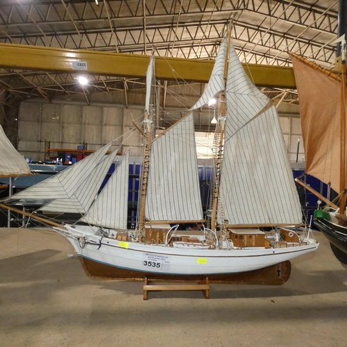 A wooden model of a two masted sailing ship