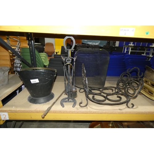 A wrought iron log basket, a spark guard, a coal bucket and various ...