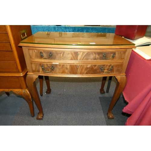 A mahogany bowfront two drawer cutlery cabinet on cabriole legs with ...