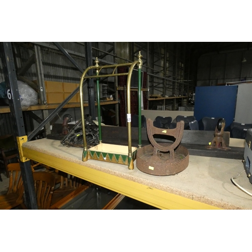 A vintage cast iron boot scraper, a vintage brass umbrella stand and ...