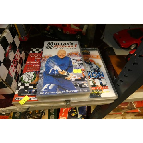A collection of boxed model racing cars and a quantity of motor racing ...