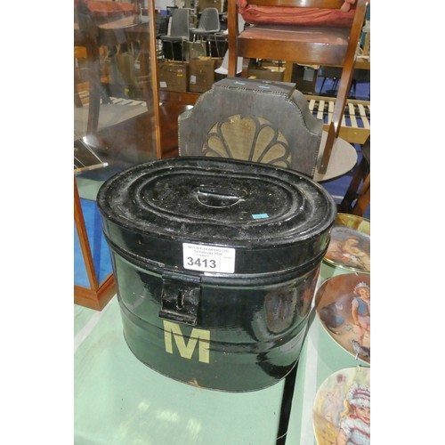 A vintage metal hat box and a vintage wooden cased radio speaker