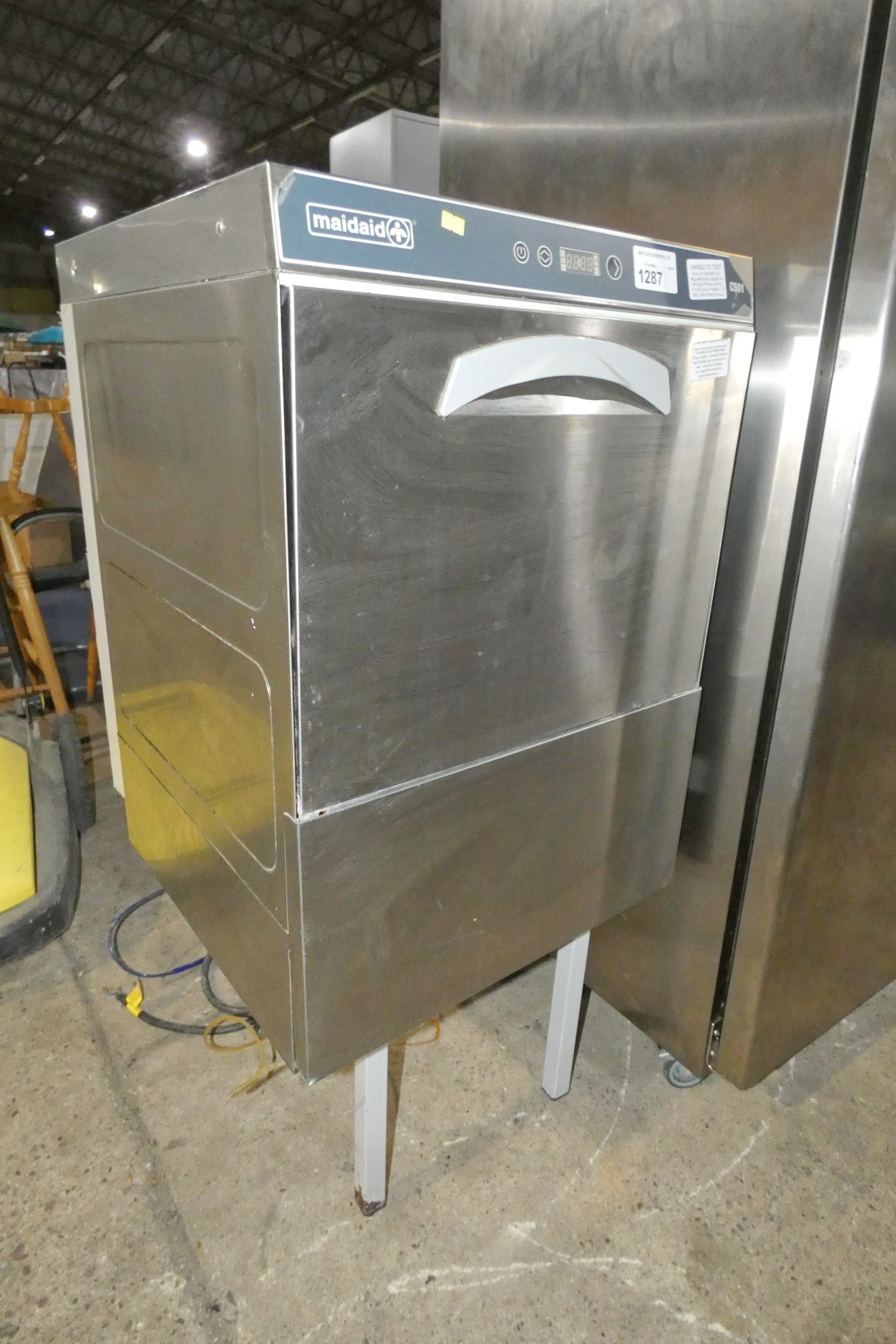 A commercial stainless steel dishwasher by Maidaid on a stand type C501 ...