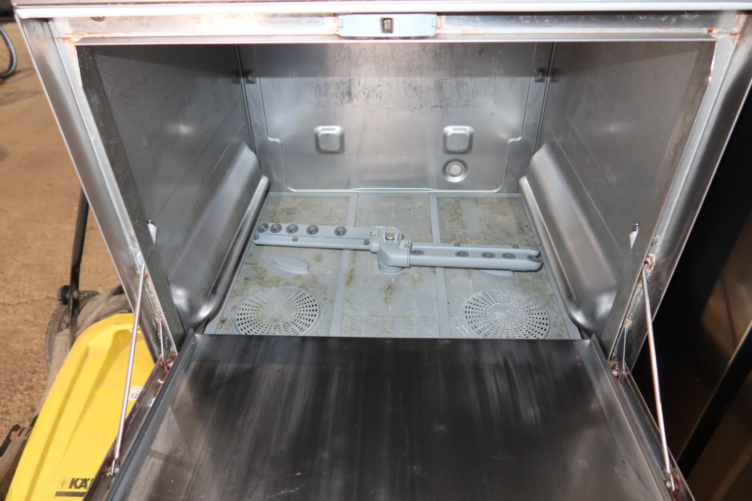 A commercial stainless steel dishwasher by Maidaid on a stand type C501 ...