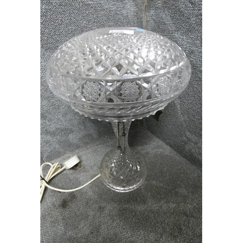 A vintage cut glass table lamp with circular cut glass shade