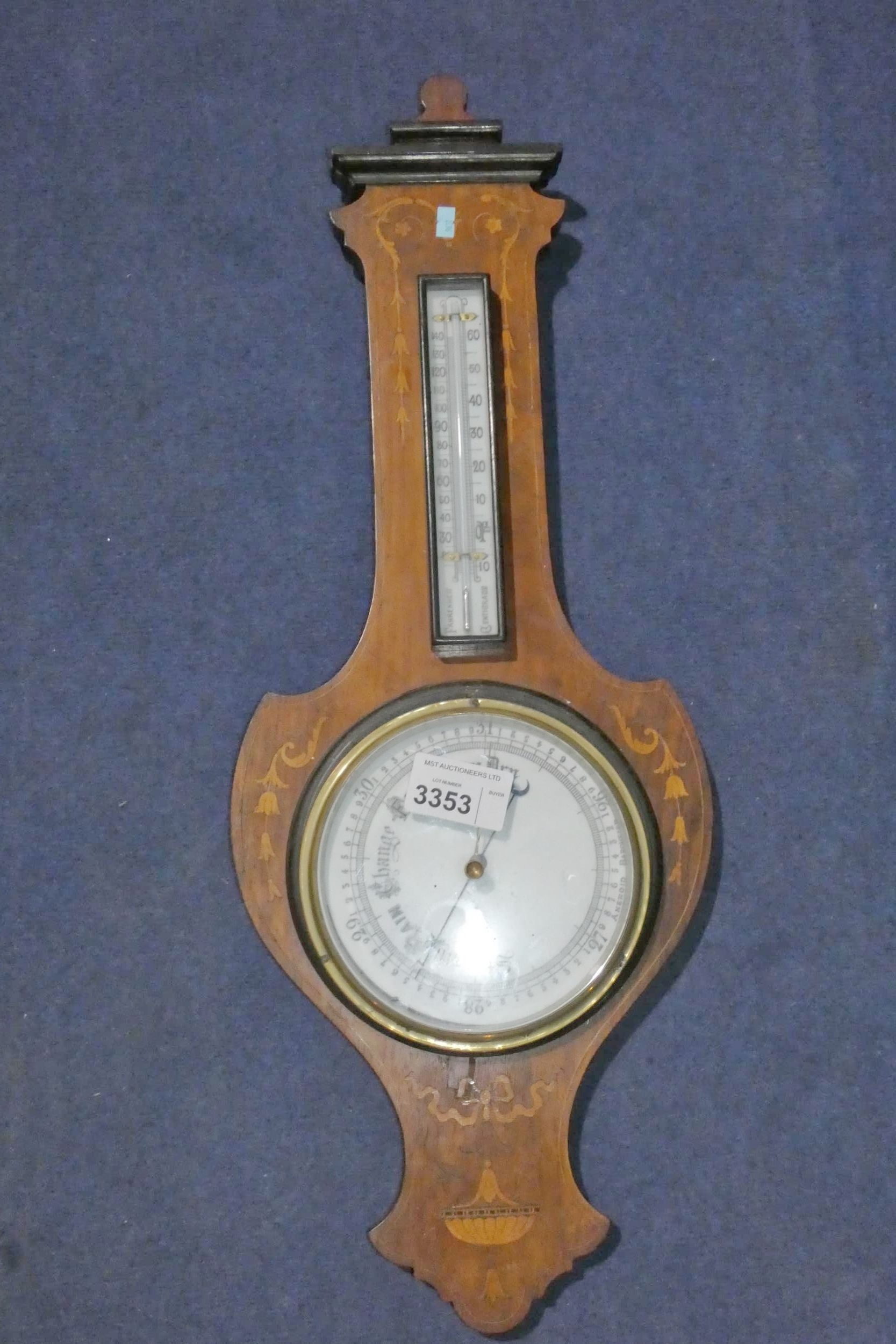 An aneroid barometer & mercury thermometer in a banjo shaped marquetry ...